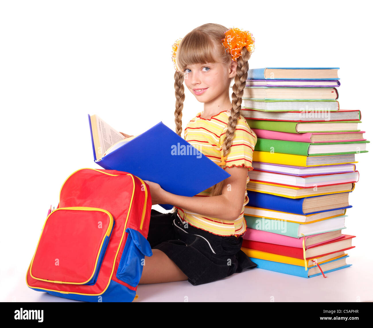 Child reading open book on table Stock Photo - Alamy