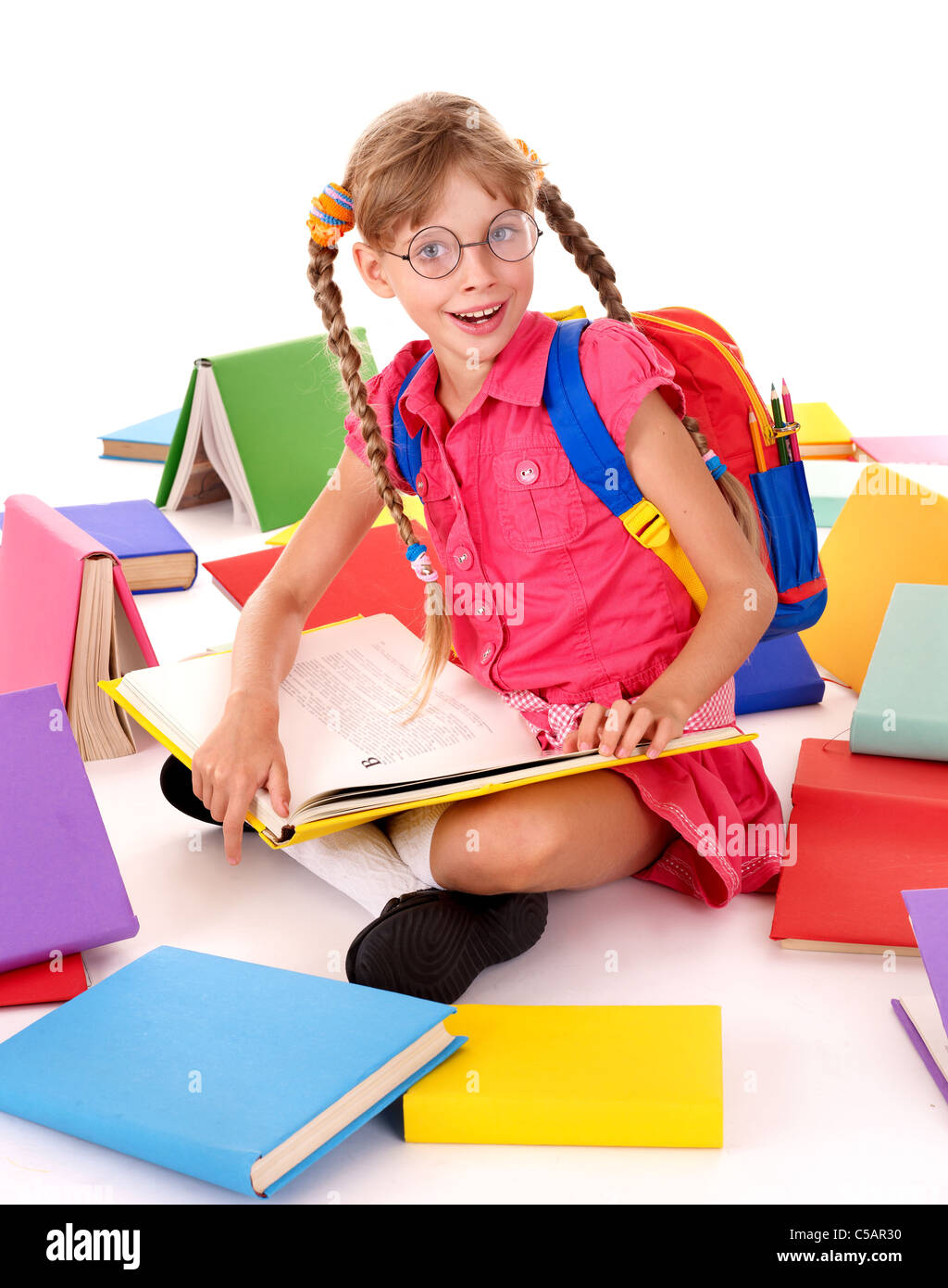 Child reading open book on table Stock Photo - Alamy