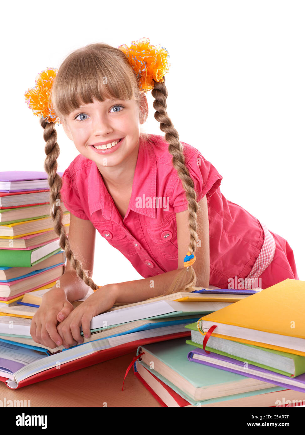 Child reading open book on table Stock Photo - Alamy