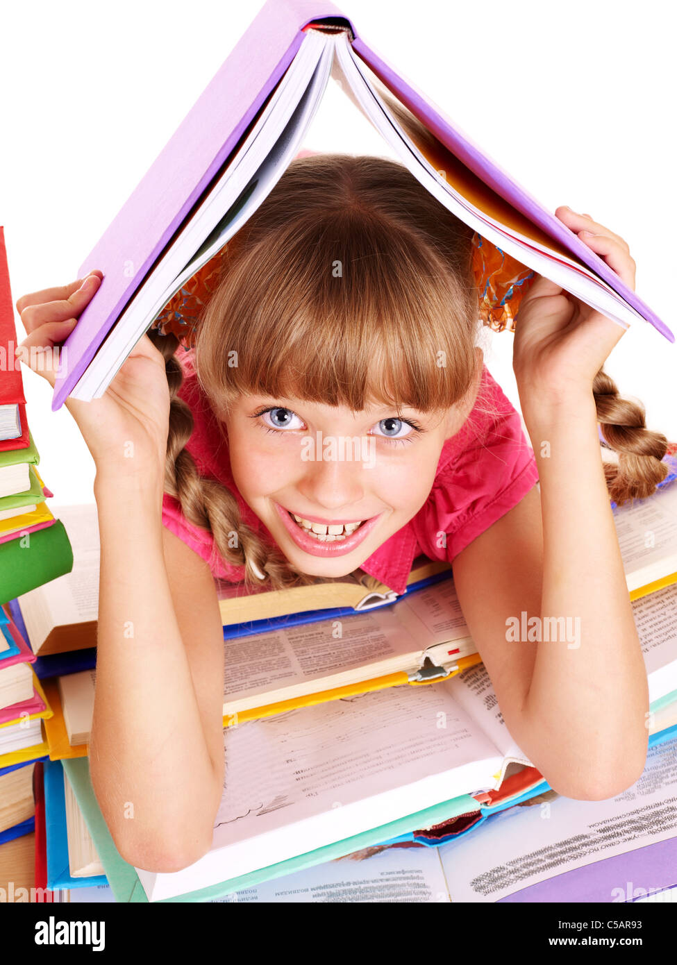 Child reading open book on table Stock Photo - Alamy