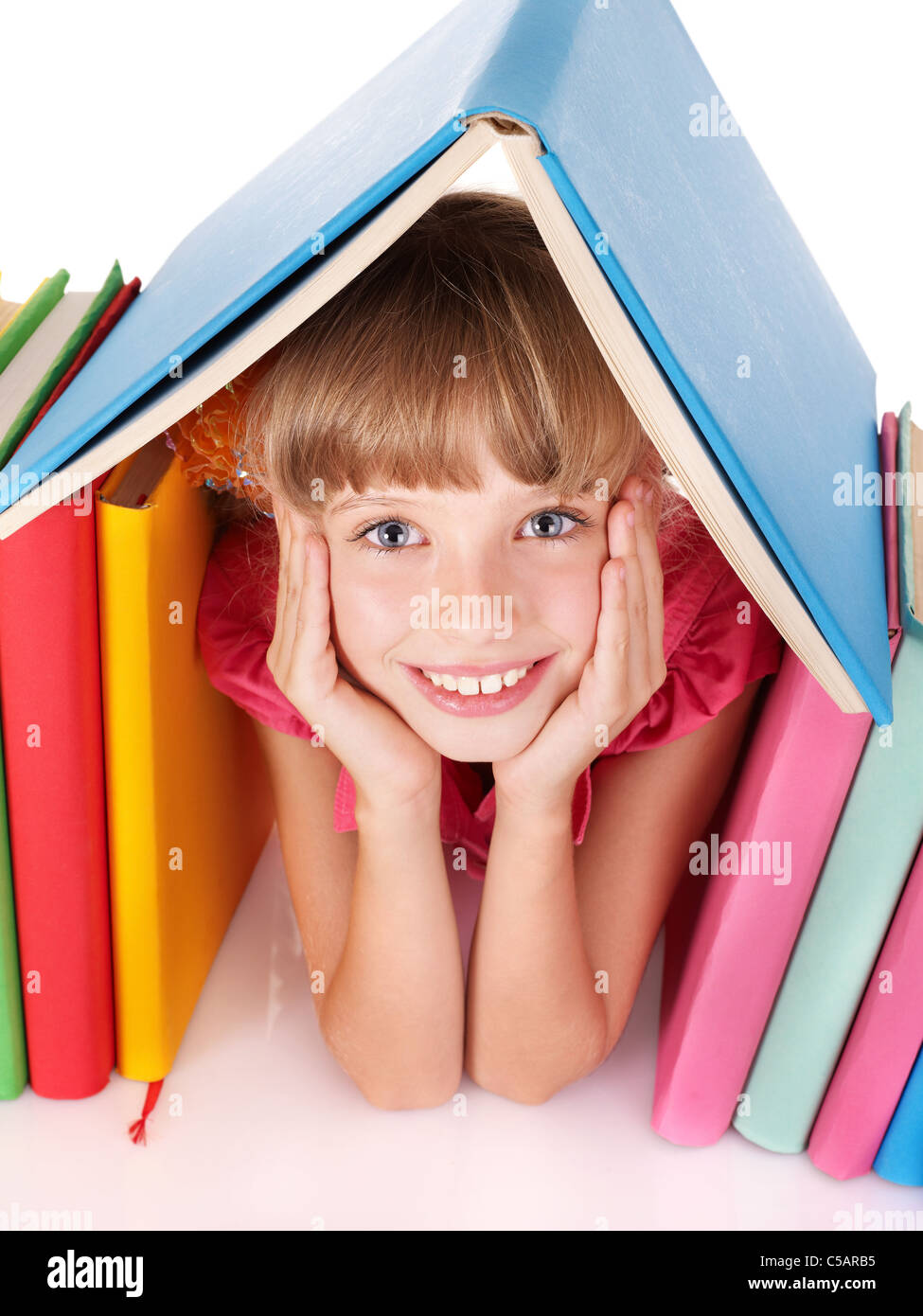 Child reading open book on table Stock Photo - Alamy