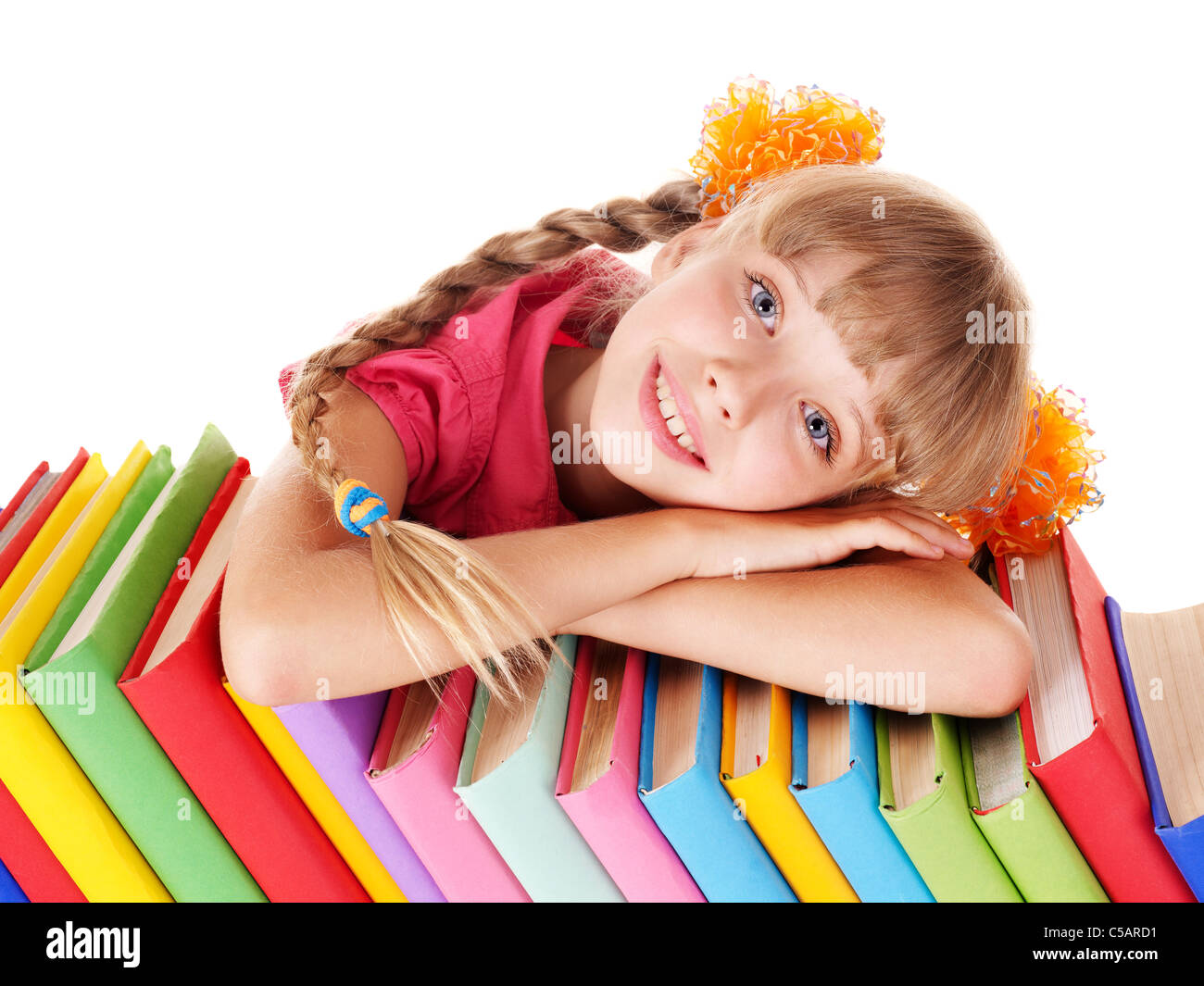 Child reading open book on table Stock Photo - Alamy