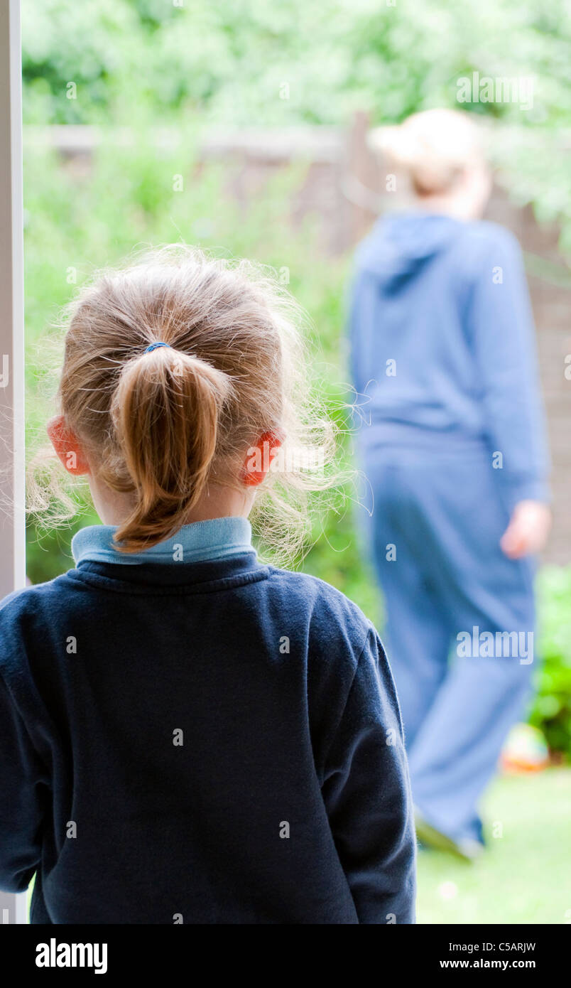 Shy little girl left out from the fun and not joining in Stock Photo ...