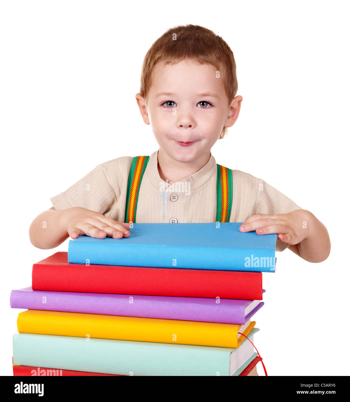Little boy reading pile of books Stock Photo - Alamy