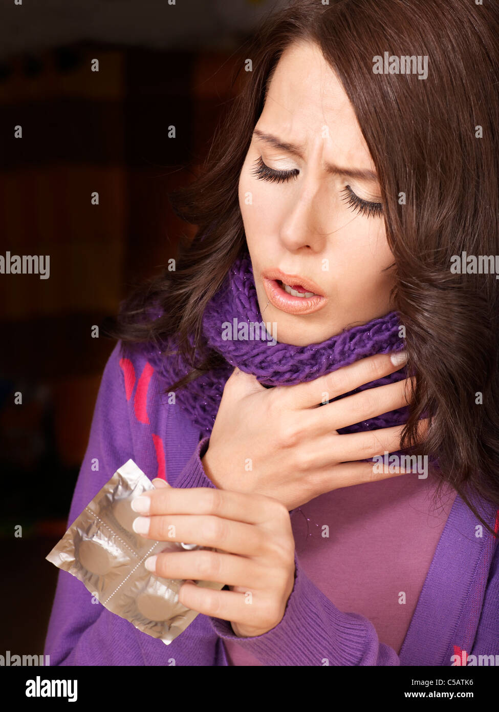 Young woman having flu takes pills Stock Photo - Alamy