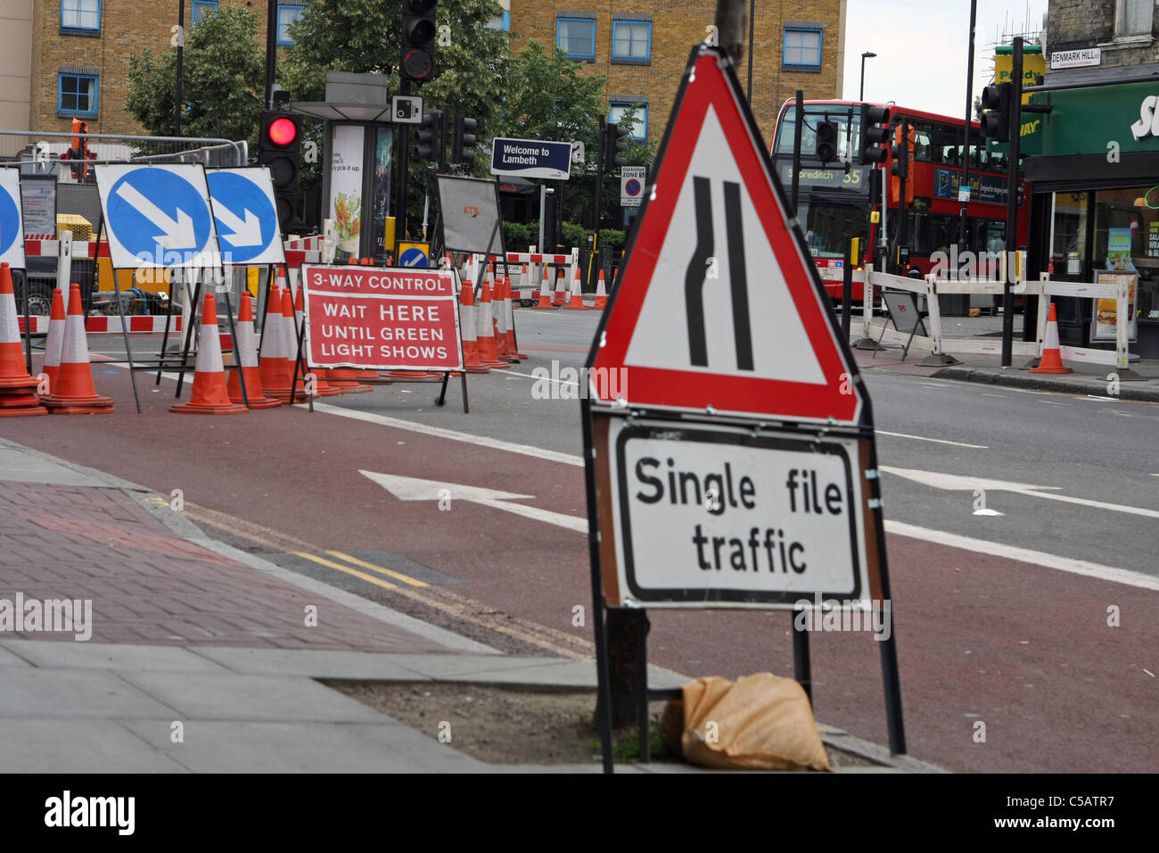 A single file traffic sign warning of a contra flow in roadworks in ...