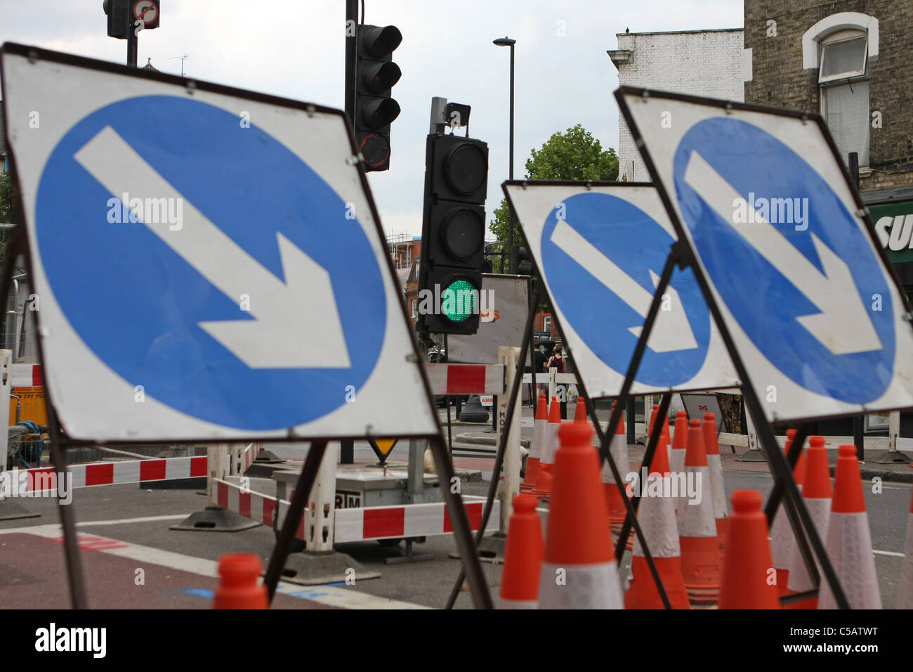 Keep right signs in roadworks in London, England, with a temporary set ...