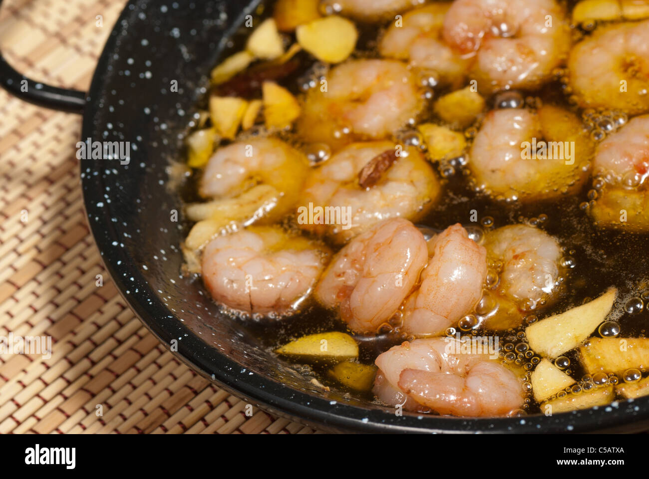 Hot sizzling prawns, a delicious Spanish tapa Stock Photo - Alamy