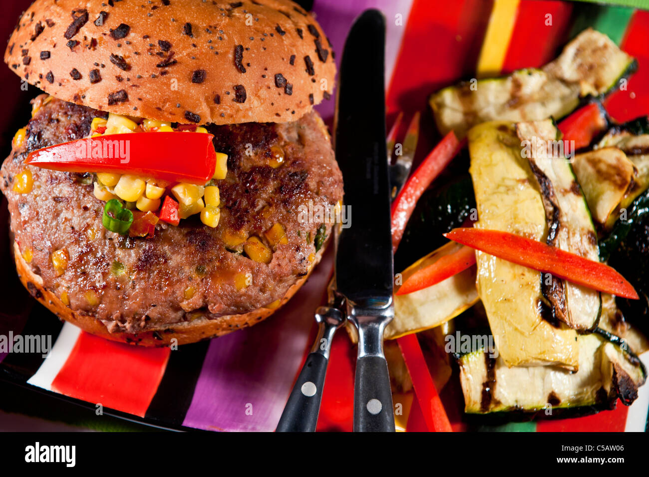 A healthy lean burger with sweet peppers, corn, green onions and ...