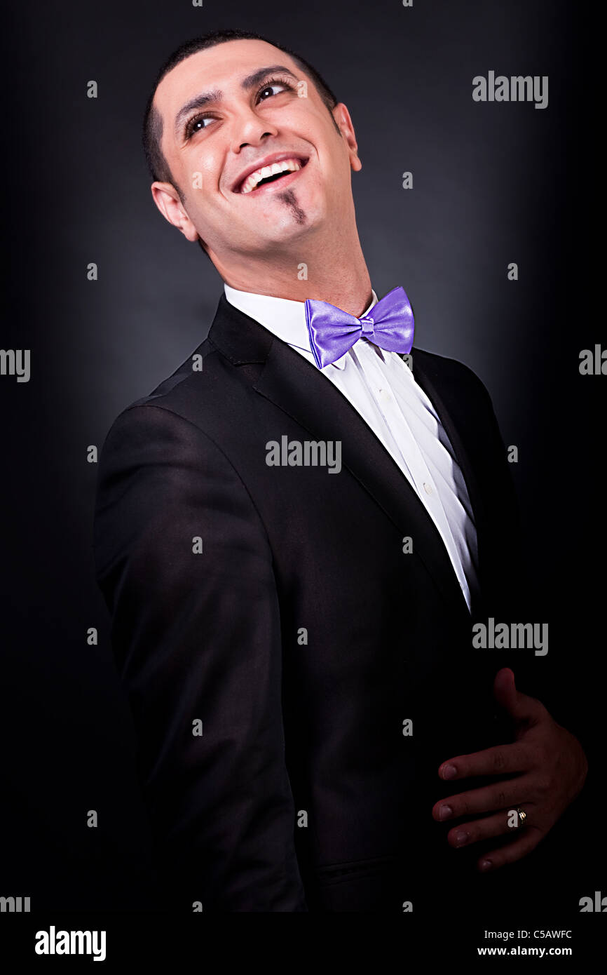 magician man looking the right corner on a black background Stock Photo ...