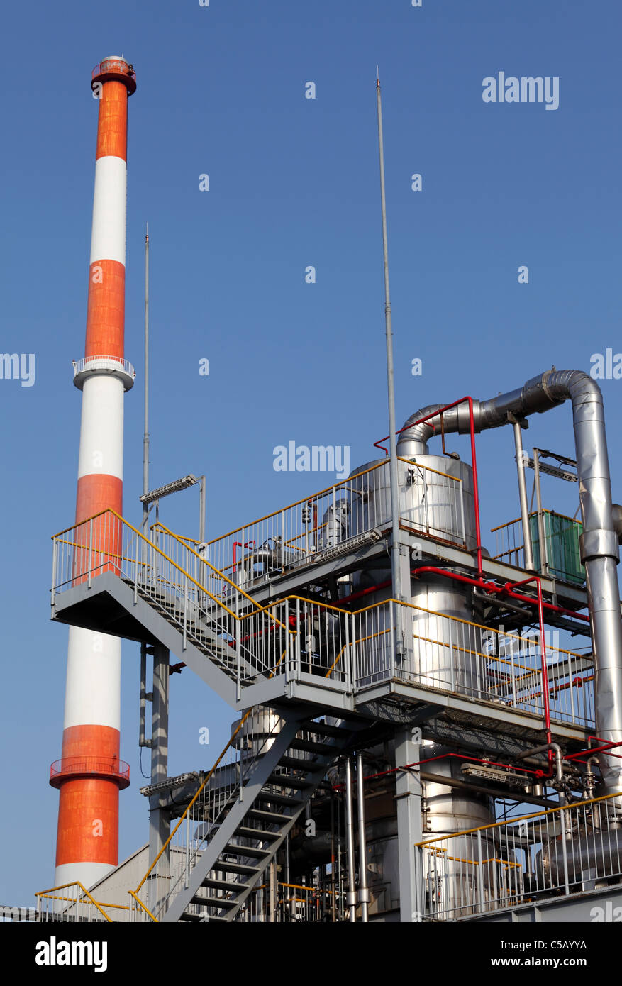 Industrial factory smokestack and sky Stock Photo - Alamy