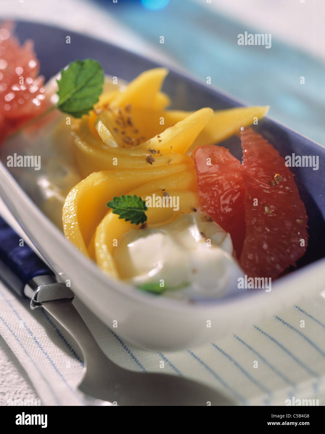 Curd meal with mango and grapefruit Stock Photo - Alamy