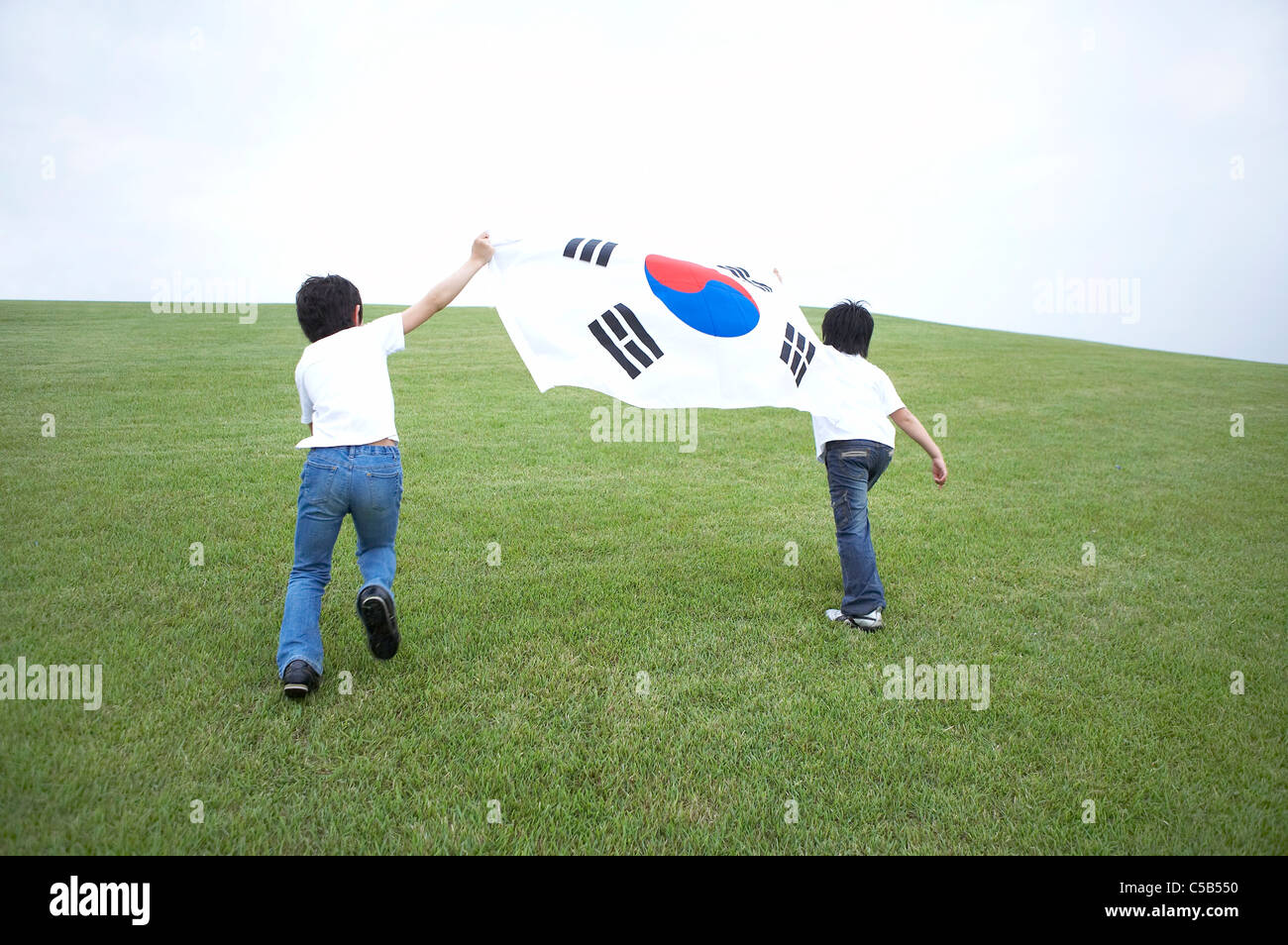 Running with flag hi-res stock photography and images - Alamy