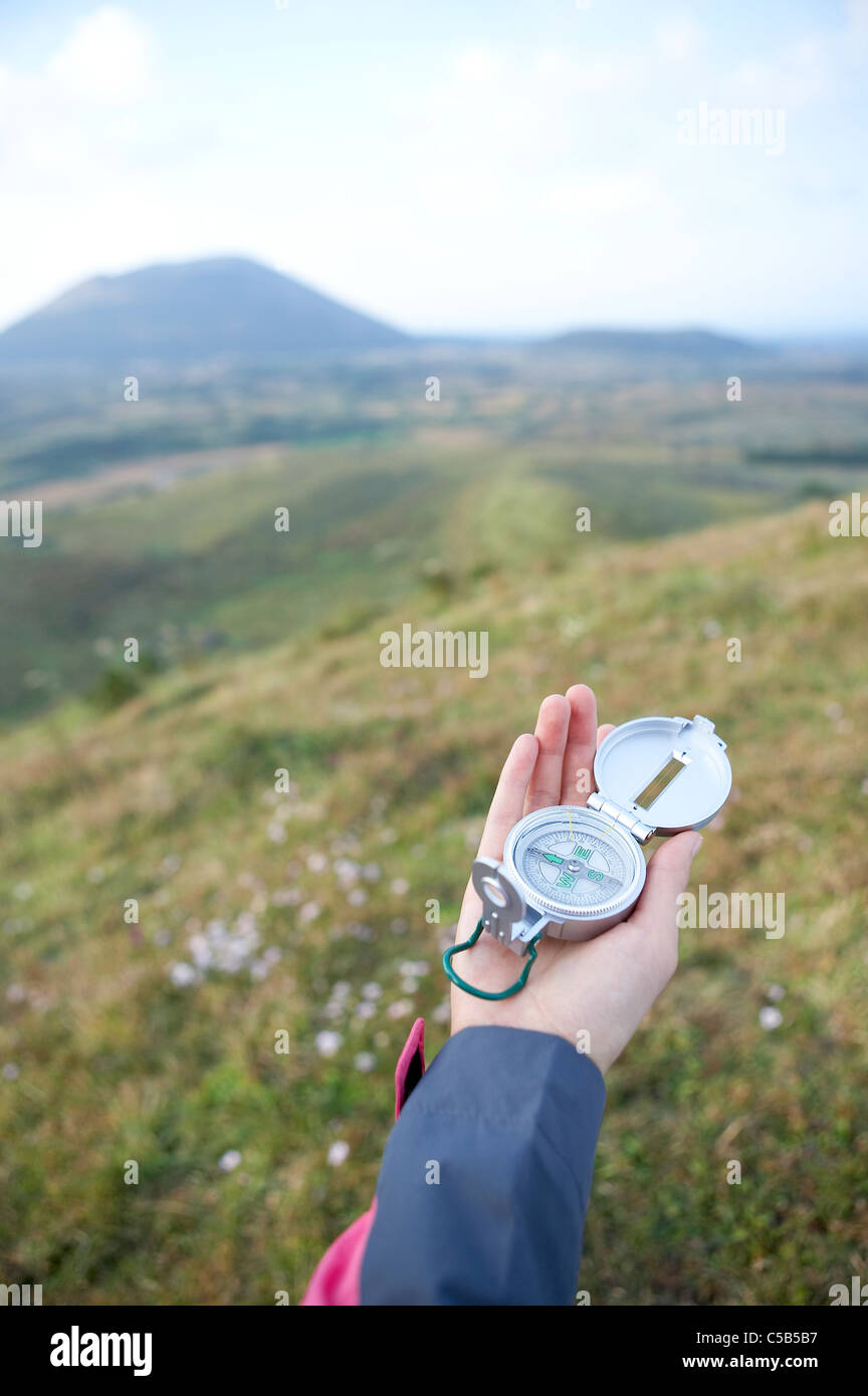 Hands holding compass body hi-res stock photography and images - Alamy