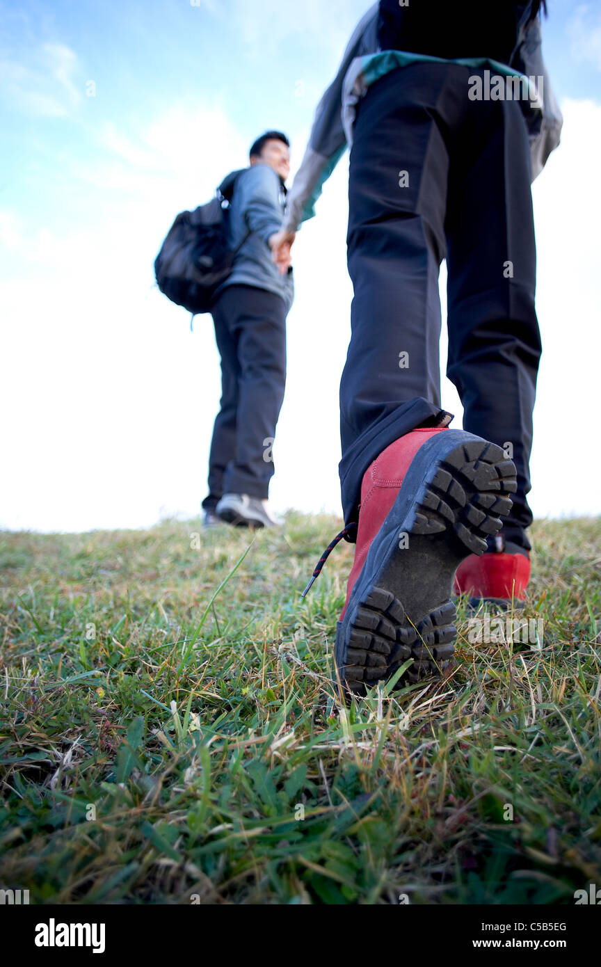 Low angle young couple hiking hi-res stock photography and images - Alamy