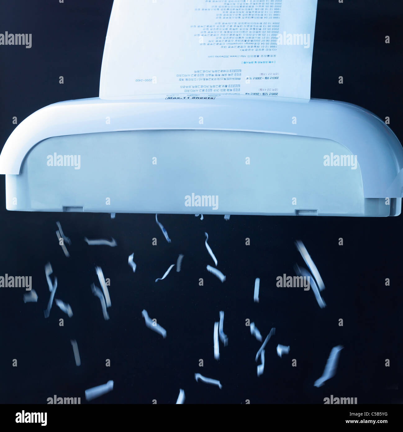 Close-up of paper being shredded Stock Photo - Alamy