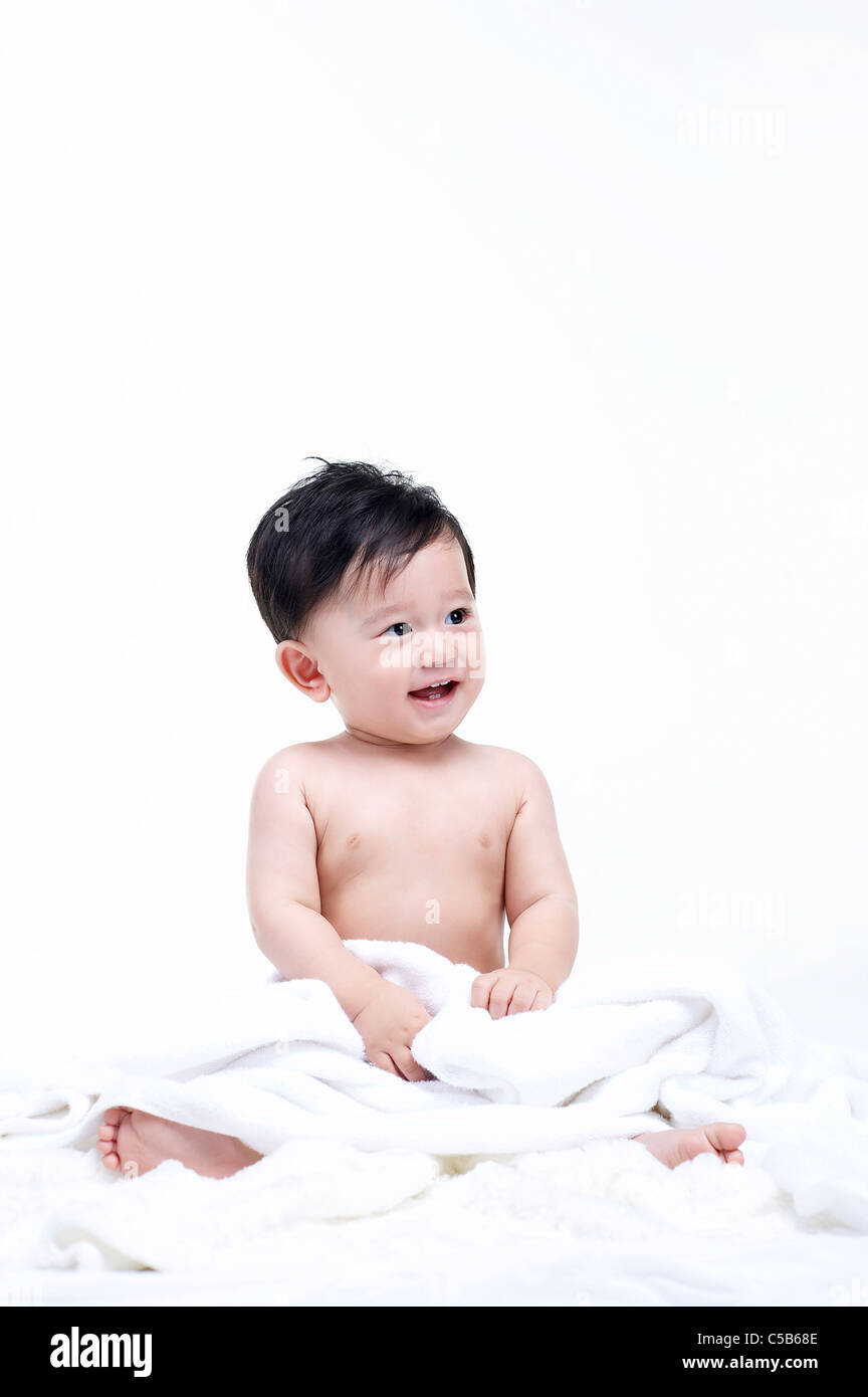 Portrait of Baby boy listening to music Stock Photo - Alamy