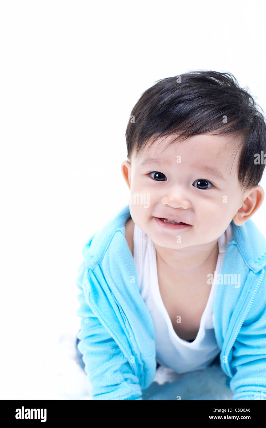 Portrait of Baby boy listening to music Stock Photo - Alamy
