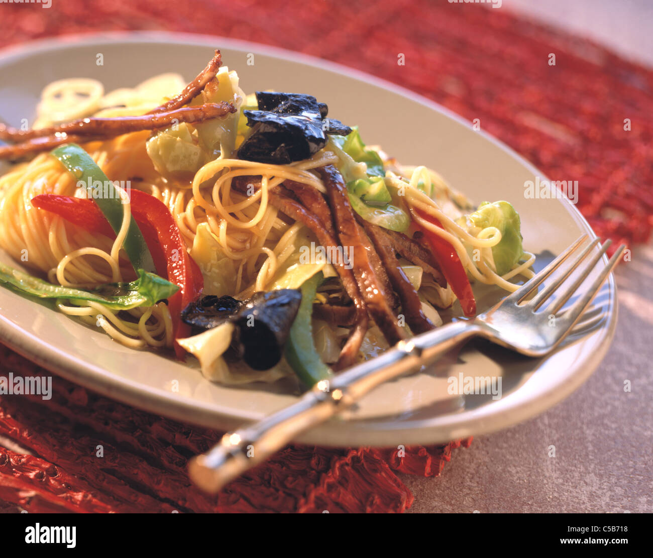Chinese five flavour noodles out of the wok Stock Photo - Alamy