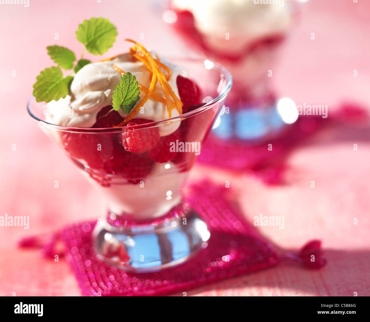 Honey - yogurt with raspberries Stock Photo - Alamy