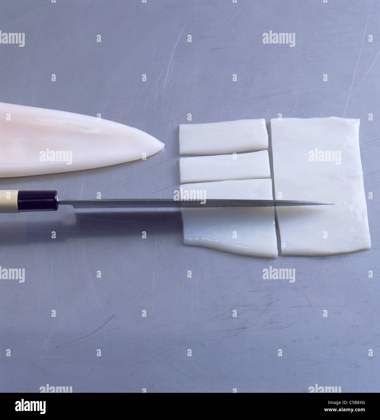 Sashimi Step Cutting squid tubes into stripes Stock Photo - Alamy