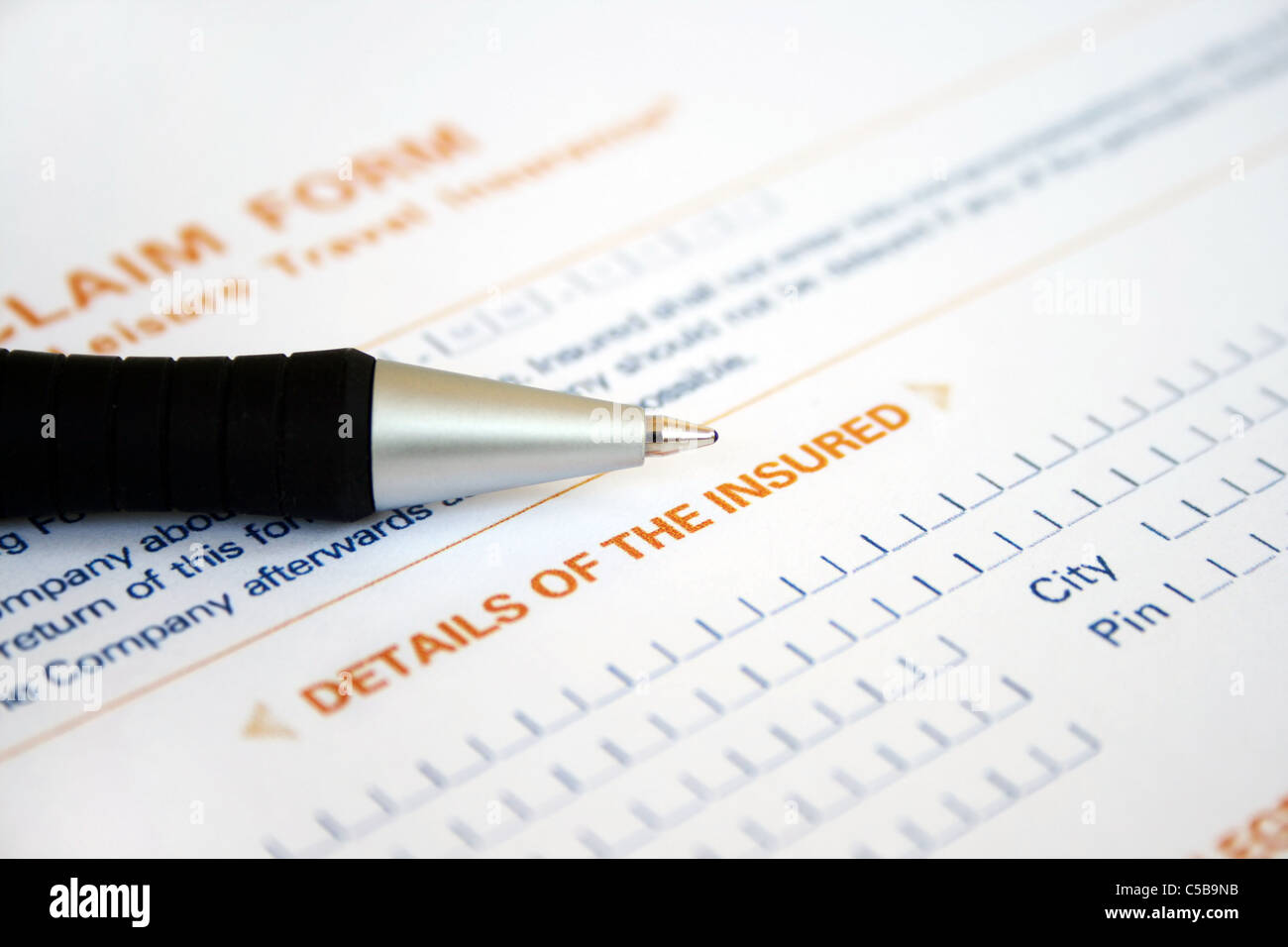 Claim form and pen Stock Photo - Alamy