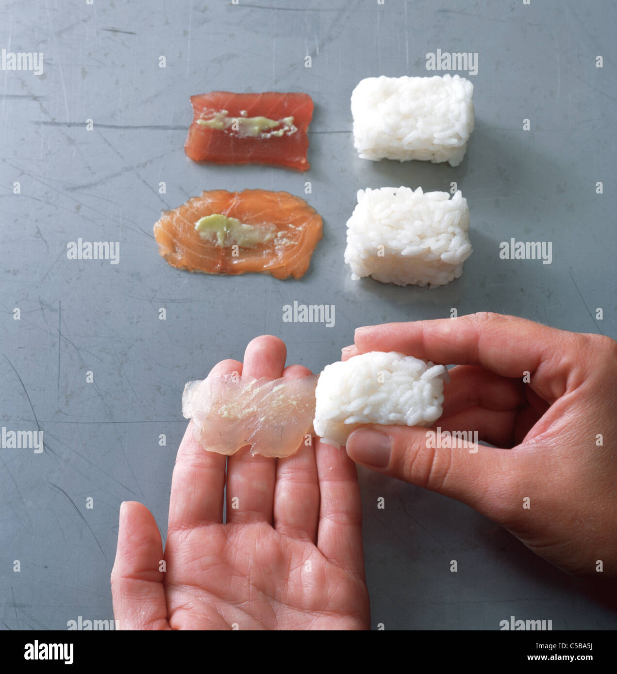 Nigiri Sushi: Laying sushi rice on the fish slice with wasabi Stock ...