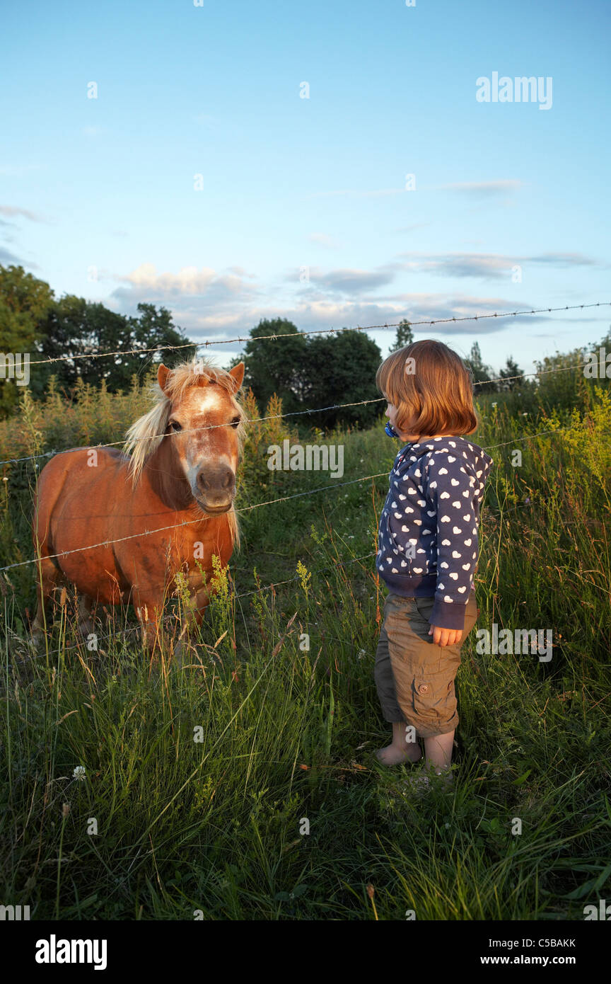Little girl pony hi-res stock photography and images - Alamy