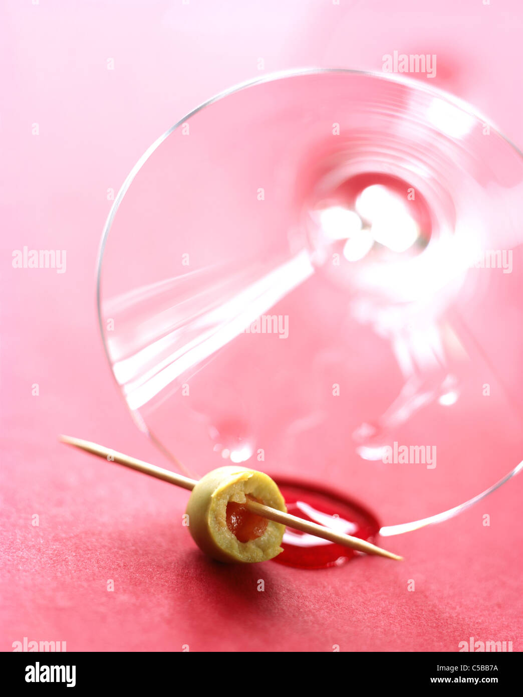 Lying martini glass with half olive hi-res stock photography and images ...