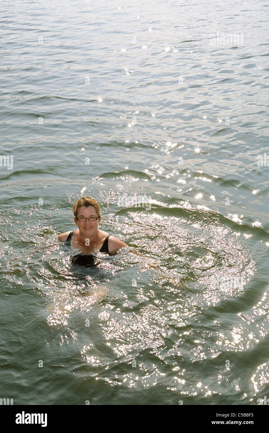 Portrait of a young woman bathing in the sea Stock Photo - Alamy