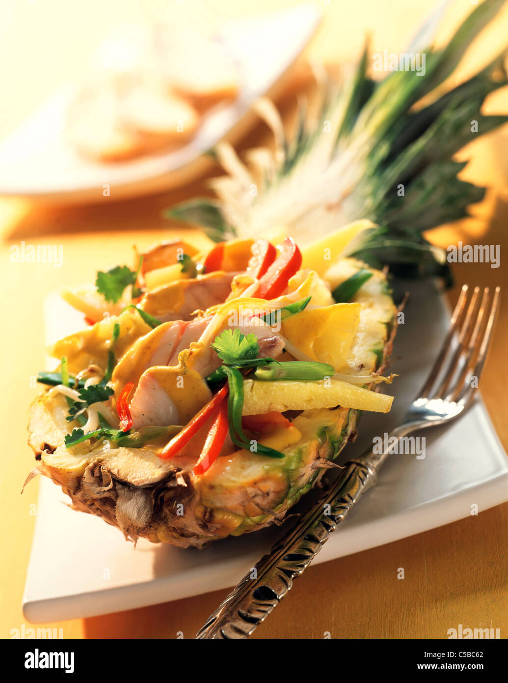 Pineapple salad with red snapper Stock Photo - Alamy
