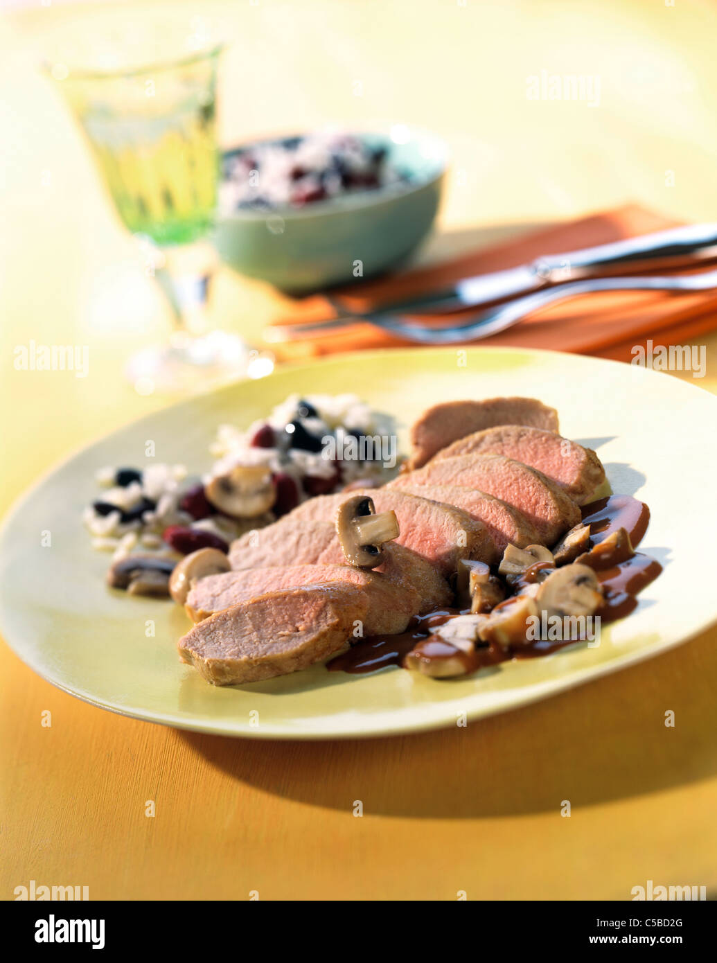 Haunch of pork with mushrooms Stock Photo - Alamy