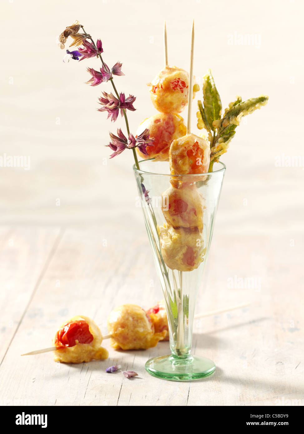 Deep fried tomato skewer Stock Photo - Alamy