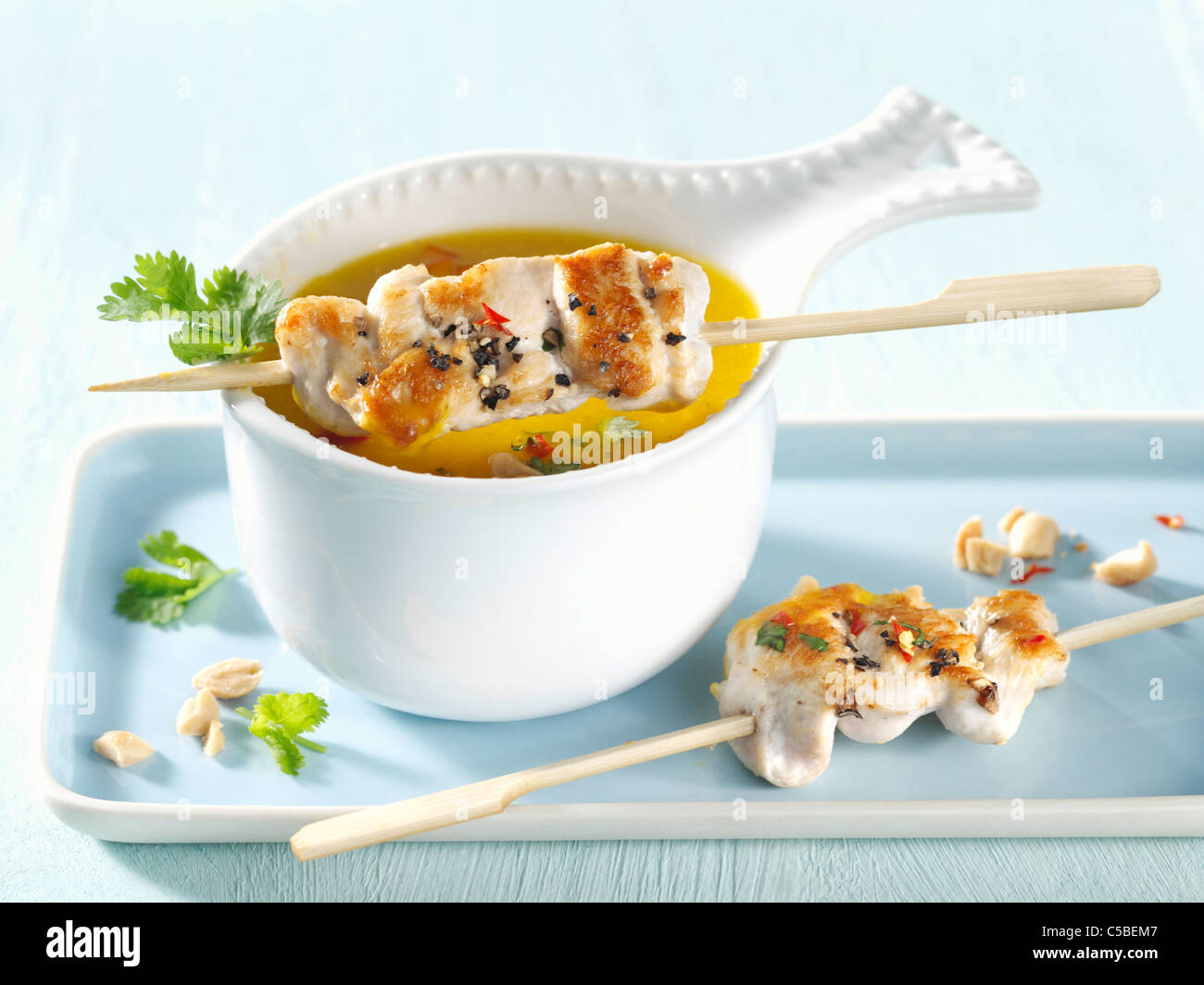 Curry soup with apricots and chicken spit Stock Photo - Alamy
