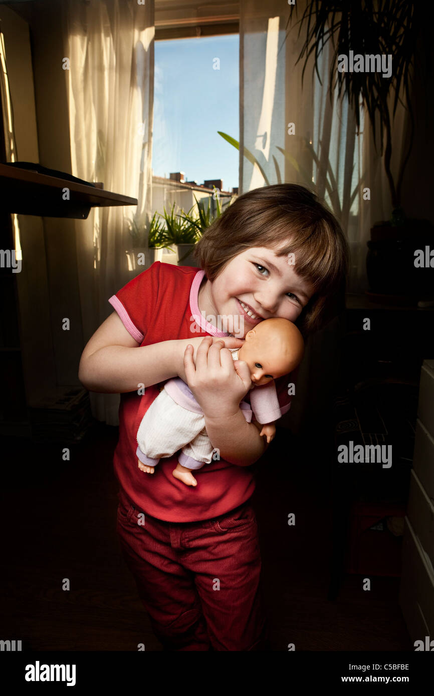 Child Hugging Her Doll High Resolution Stock Photography and Images - Alamy