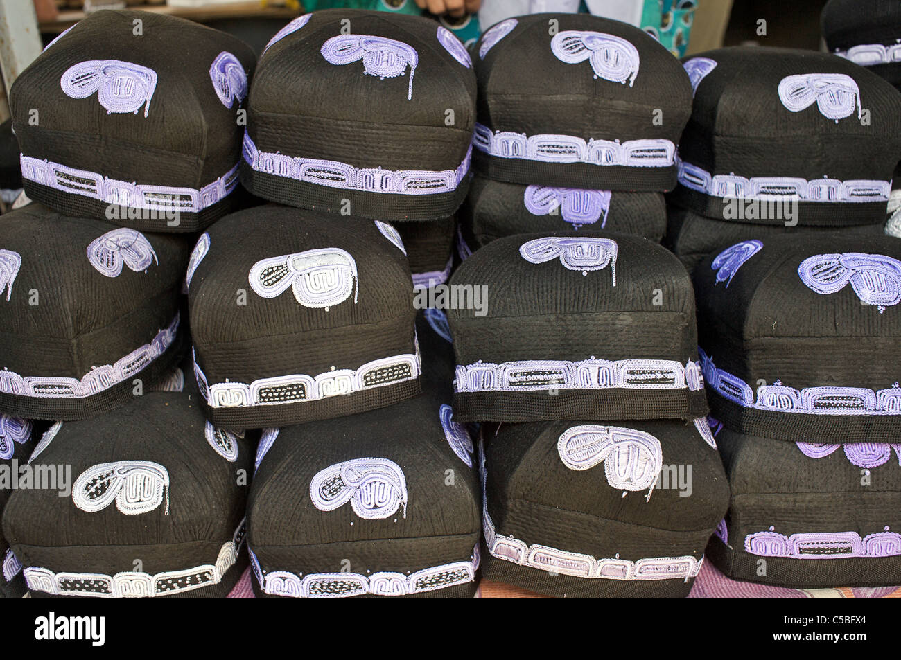 Selection of traditional handmade golden Uzbeki hats on a stall at ...
