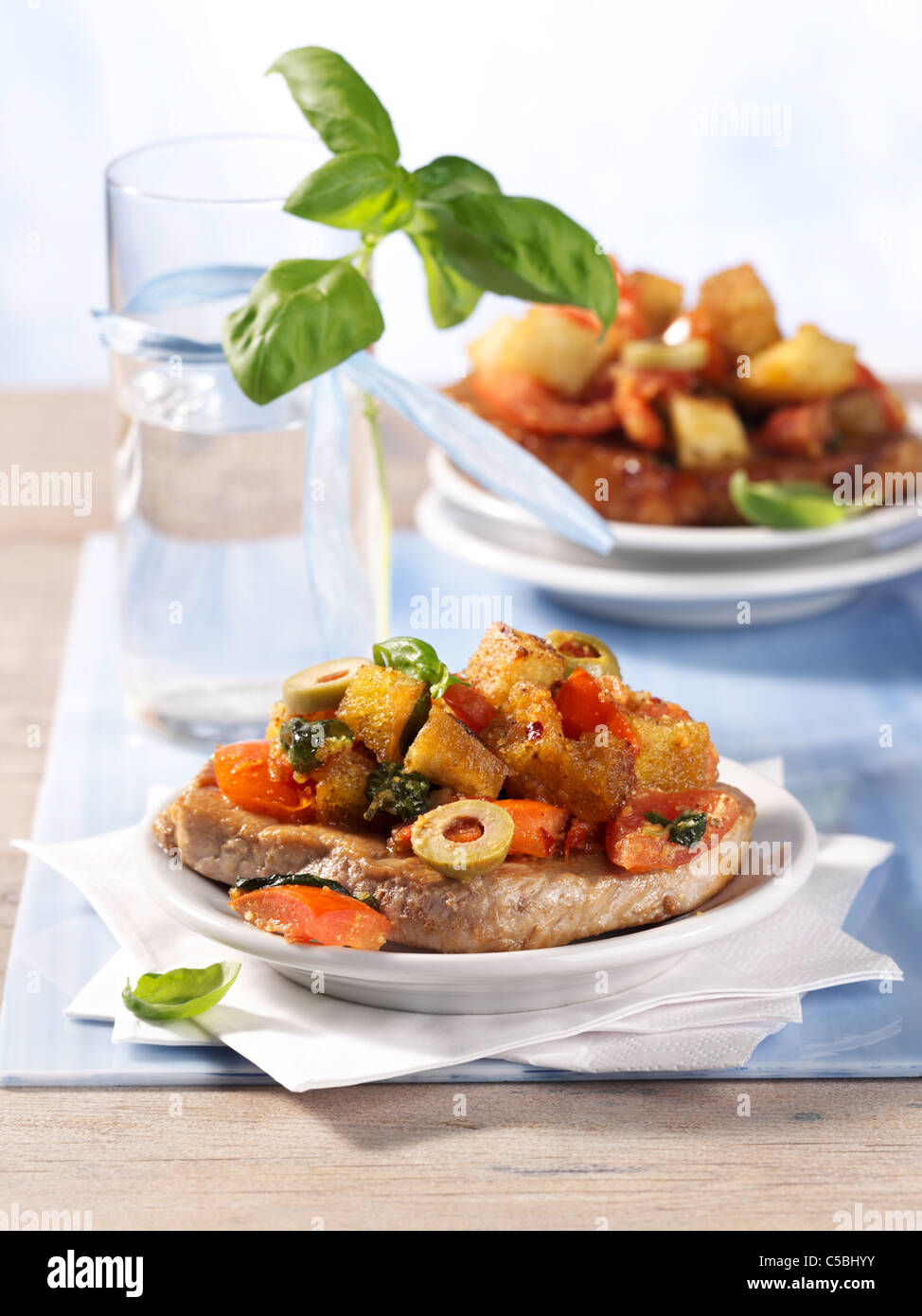 Schnitzel italian style with bruschetta Stock Photo - Alamy