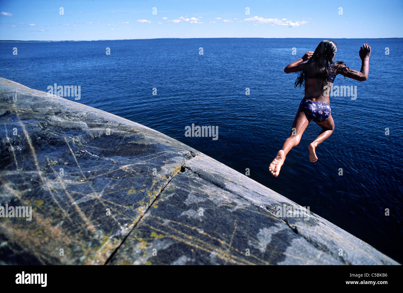 Jumping from a cliff scandinavia hi-res stock photography and images ...