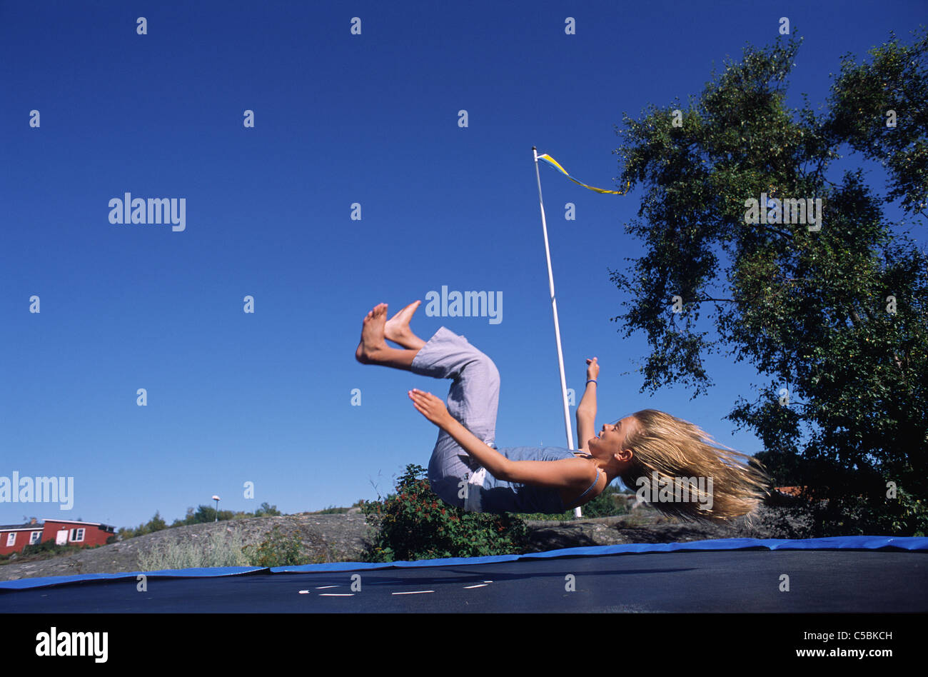 Girl doing somersault on exercise hi-res stock photography and images ...