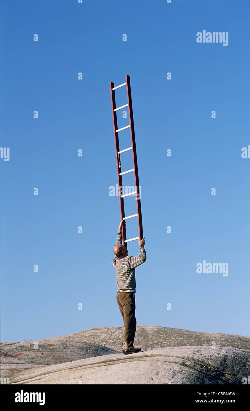 Old person holding ladder hi-res stock photography and images - Alamy