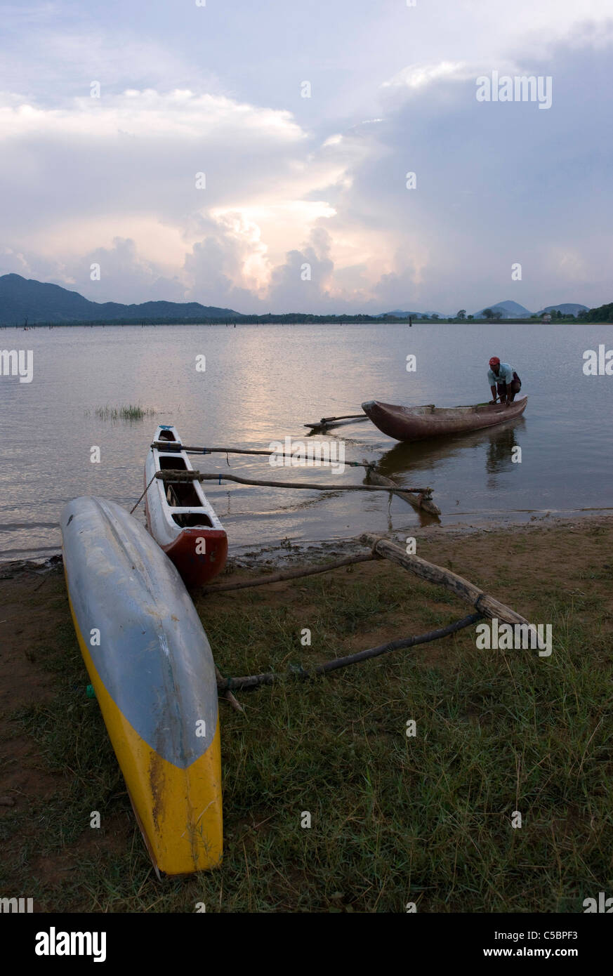 Modified canoes of fishermen. Kandalama Lake. Sri Lanka Stock Photo - Alamy