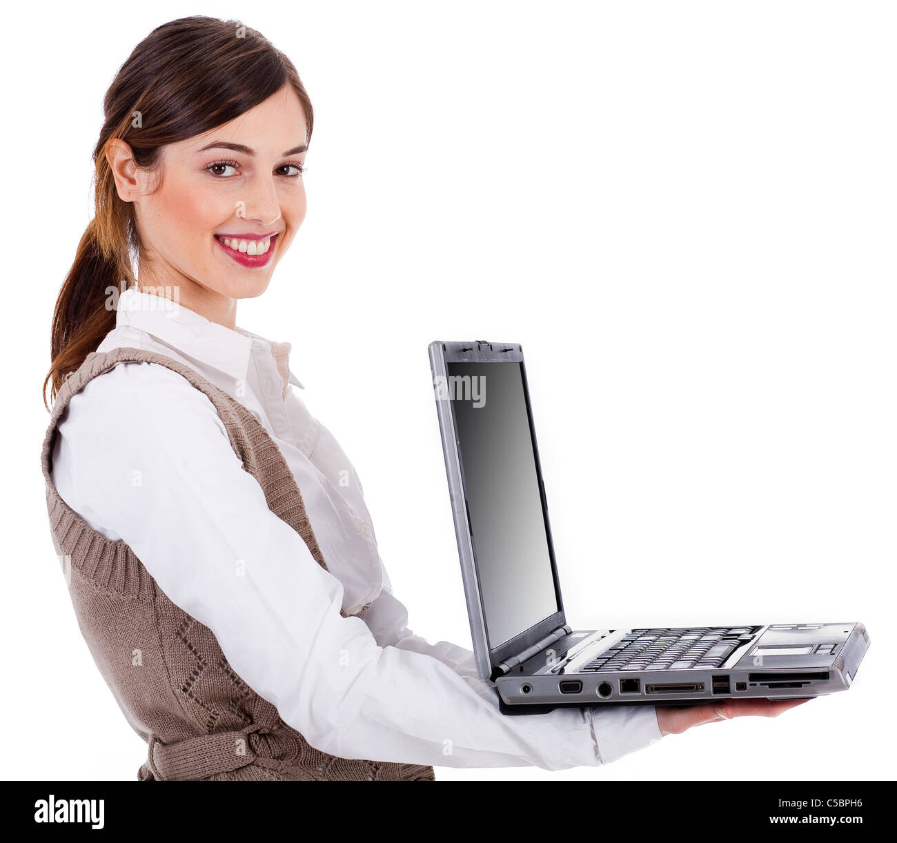 Fashion model holding a open laptop on a white isolated background ...