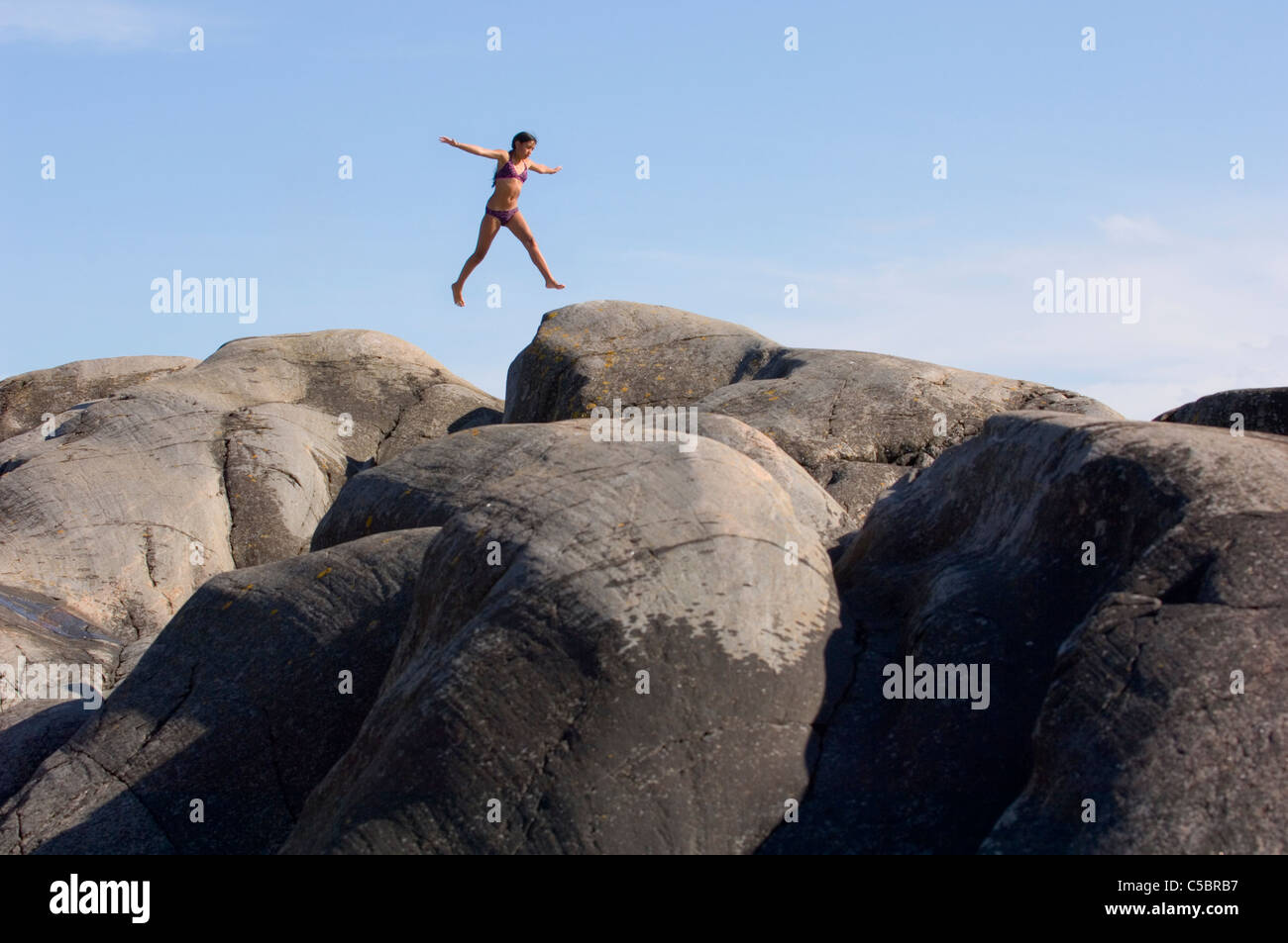 Leap on rocks child hi-res stock photography and images - Alamy