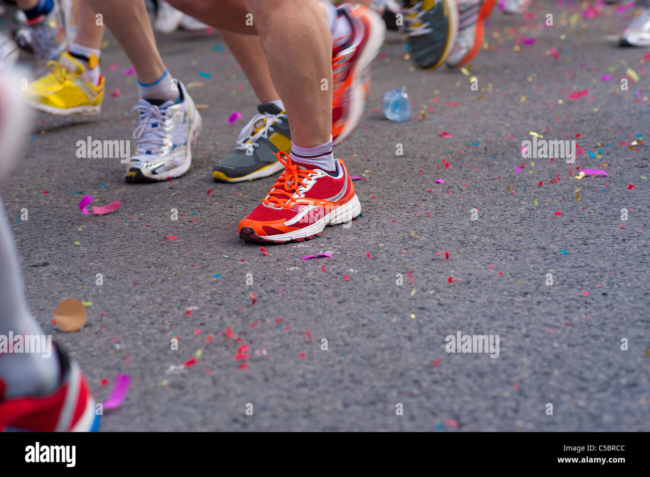 Rushing feet of many athletes at a marathon start Stock Photo - Alamy