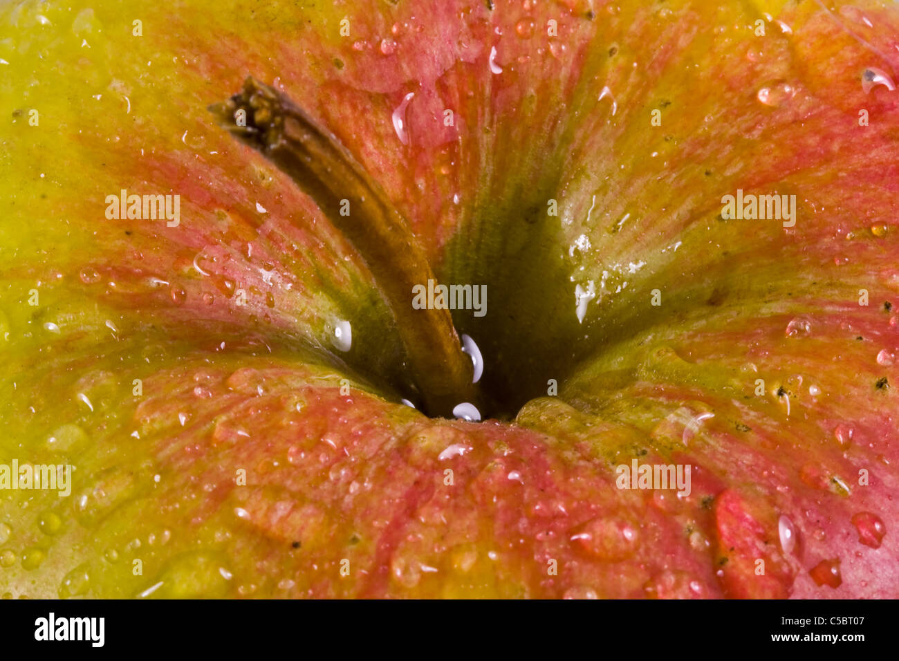 Apple with water drops closeup Stock Photo - Alamy