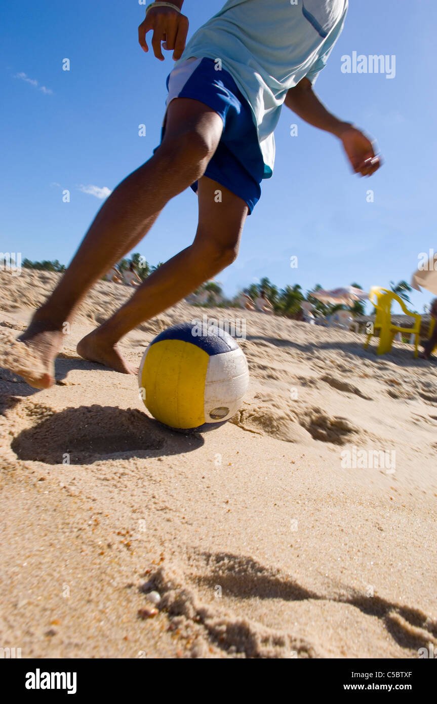 Playing football at the beach hi-res stock photography and images - Alamy