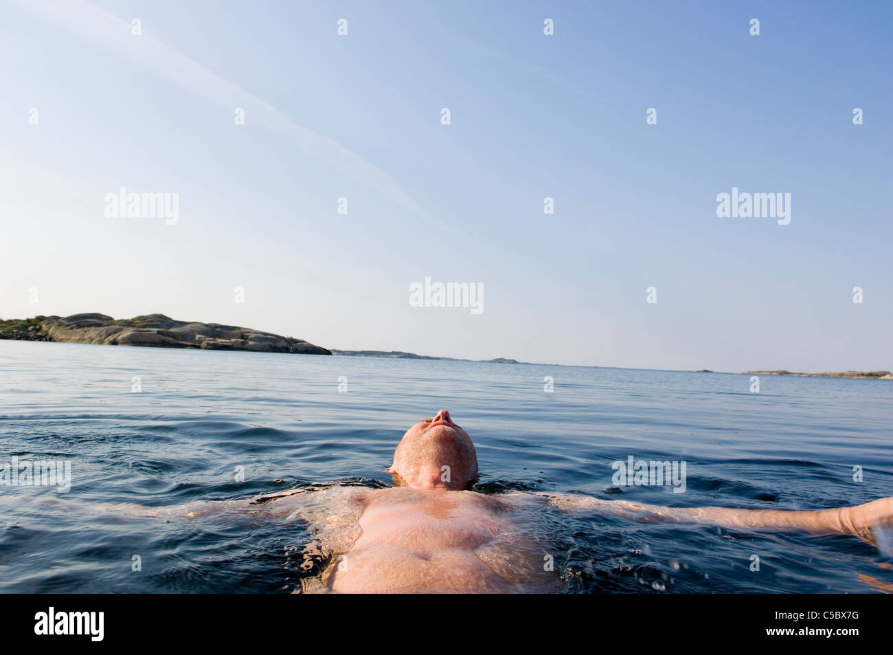 Man floating sea hi-res stock photography and images - Alamy