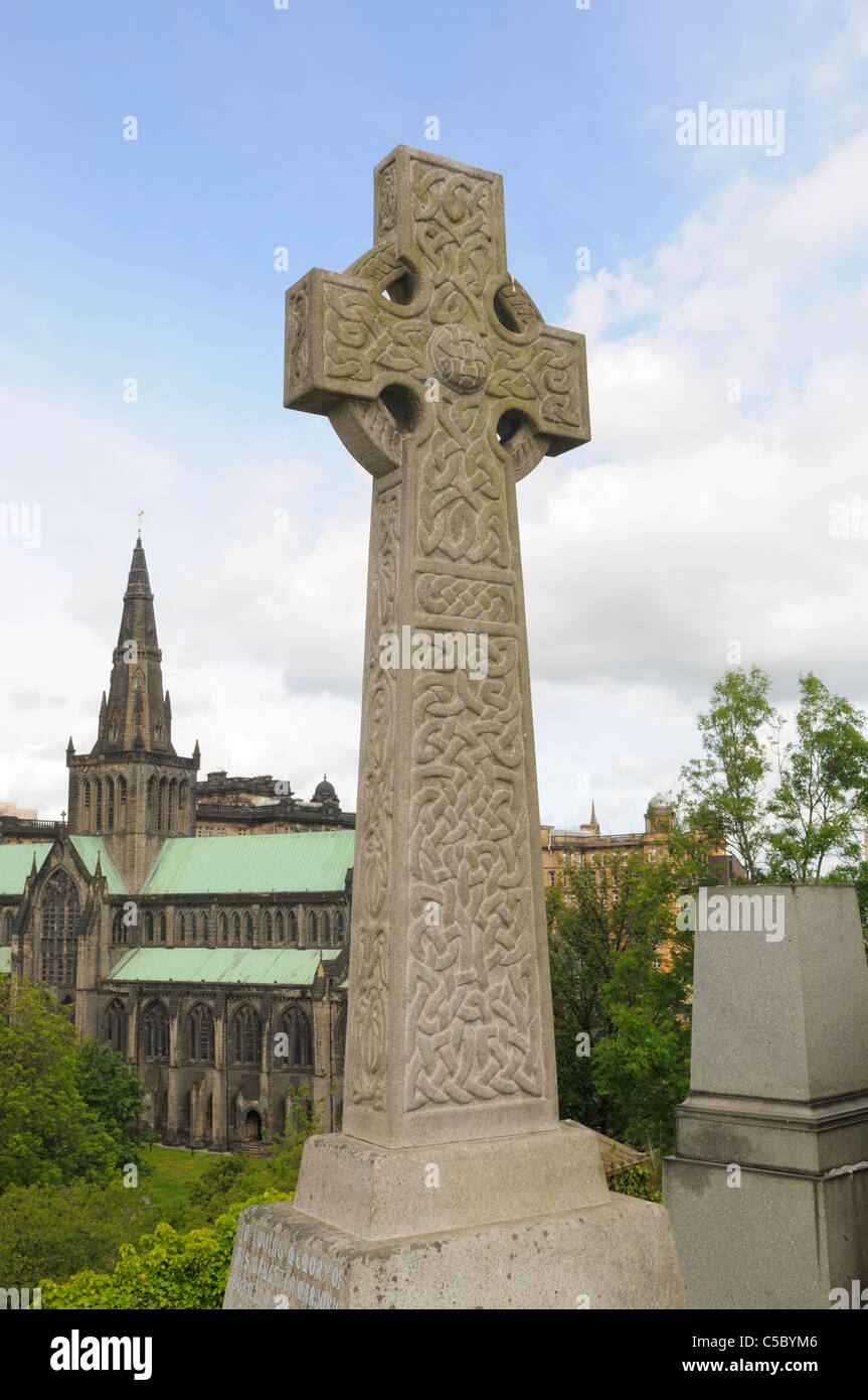 A Celtic Cross With The Cathedral Behind It In Glasgow Necropolis Stock ...