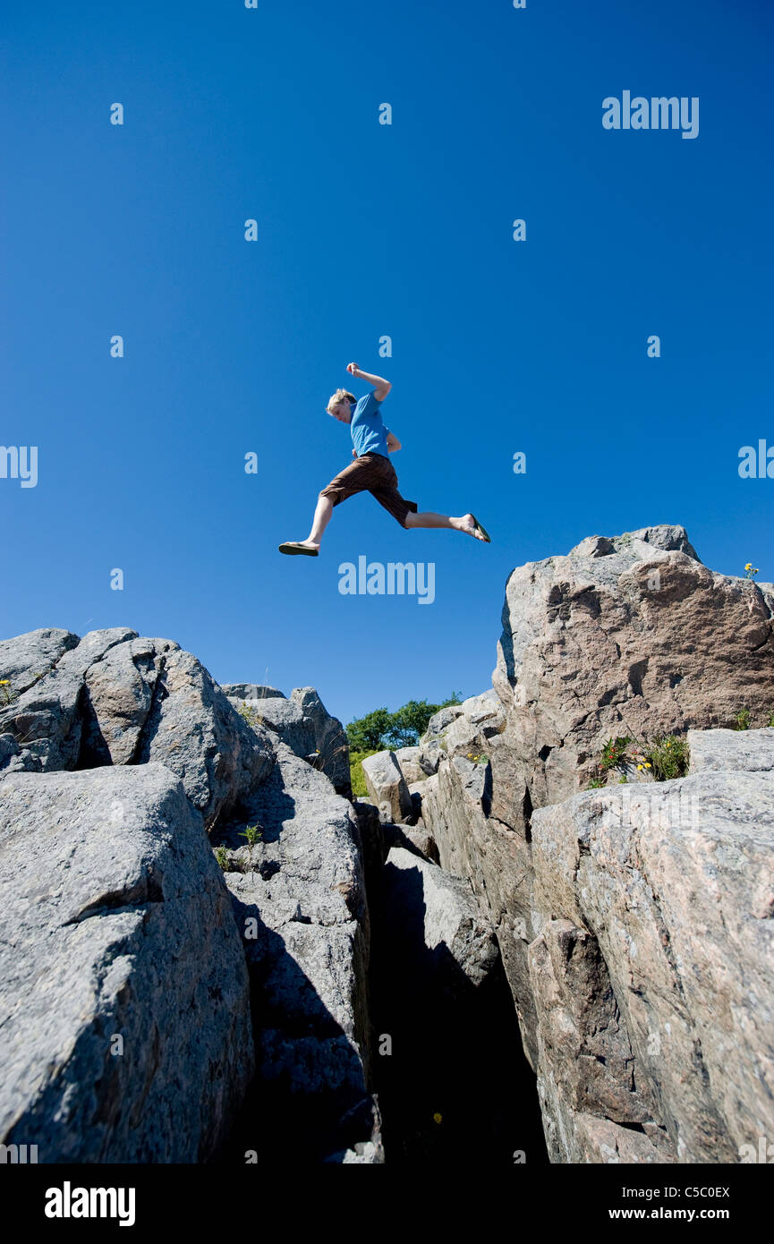 Boy playing with rocks hi-res stock photography and images - Alamy