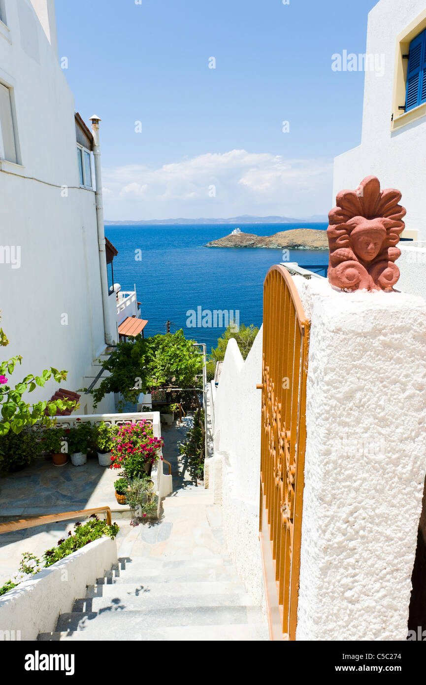 Pathway amid Greek houses with Aegean sea in the background Stock Photo ...